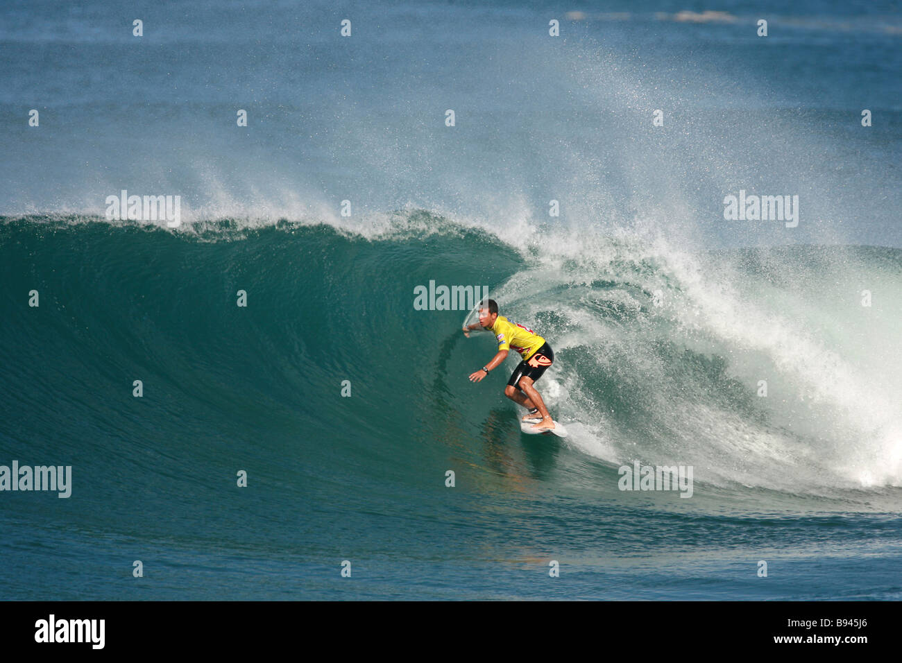 A Surfer riding a wave Stock Photo - Alamy