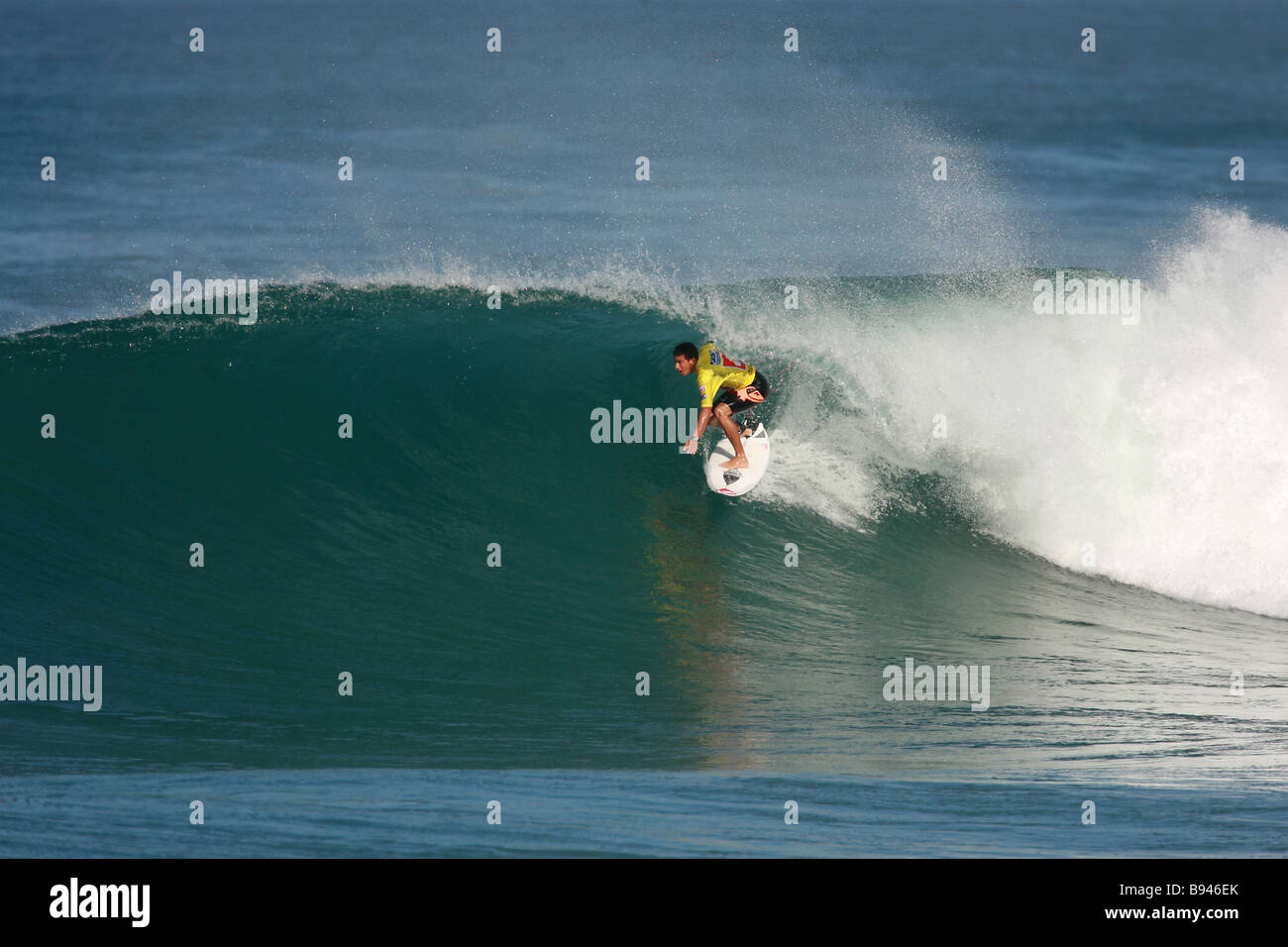 A Surfer riding a wave Stock Photo - Alamy