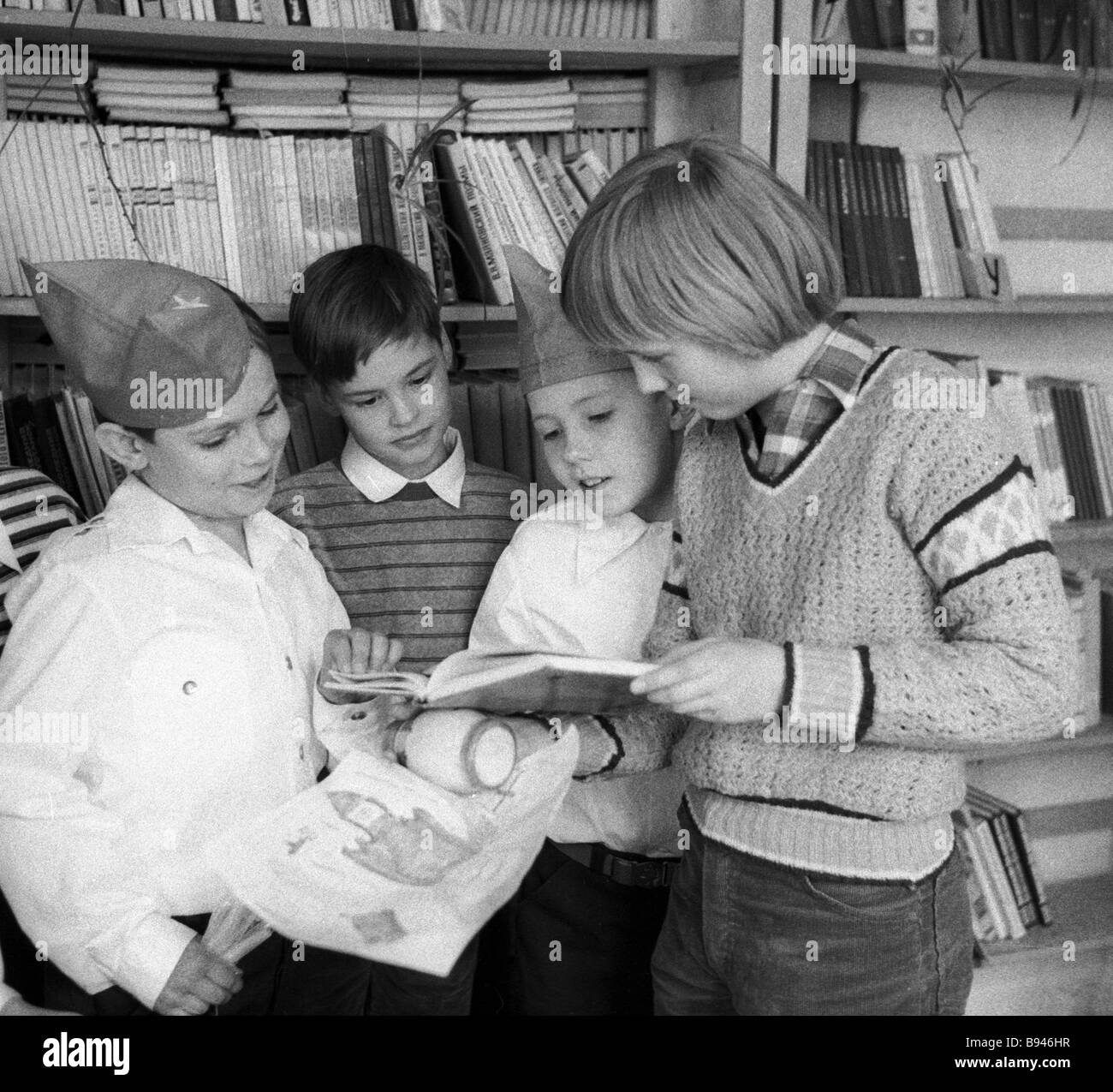 Finnish schoolchildren choosing books to read at a school library ...
