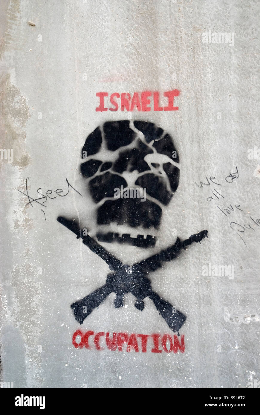 Palestine West Bank . Separation wall. Graffitti of skull and guns and ...