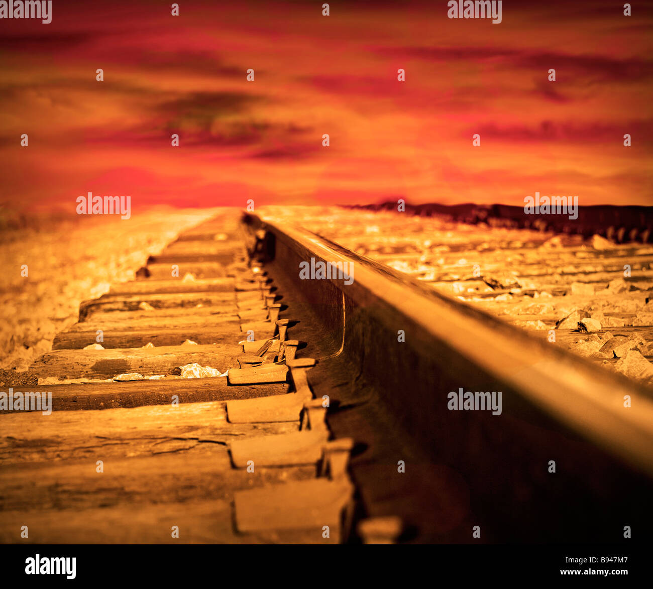 Train tracks fading towards the horizon at sunset Stock Photo - Alamy