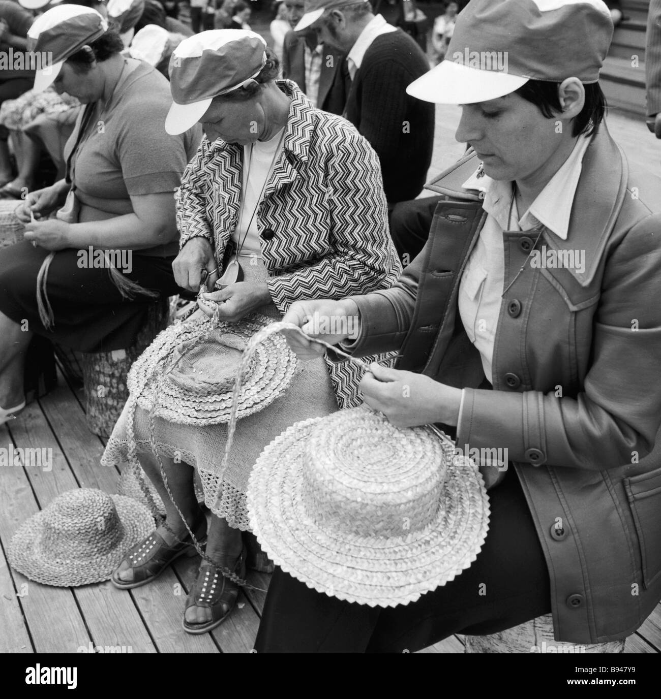 Women competing in the art of hat weaving on the All Trades Holiday ...