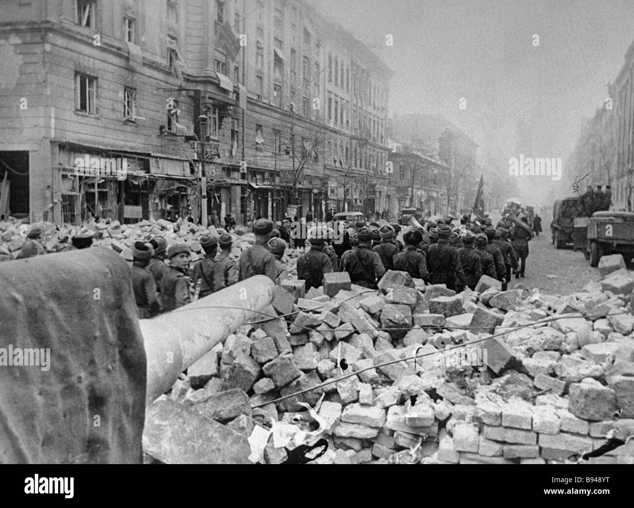 Soviet troops marching along the street in a liberated district of ...