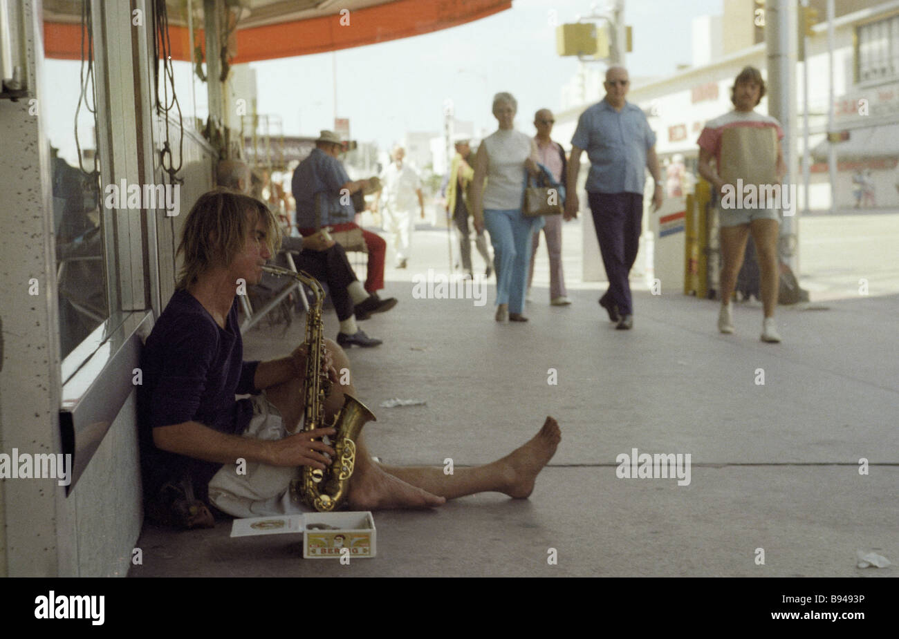 A musician plays a sax in a street of Miami Stock Photo - Alamy