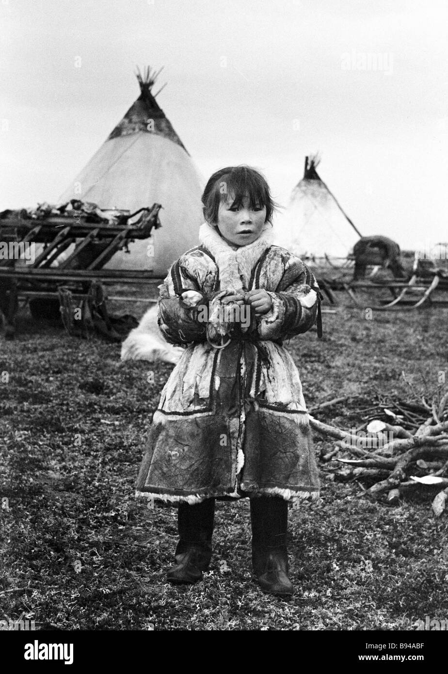 Little Nenets girl wearing ethnic clothes Stock Photo - Alamy