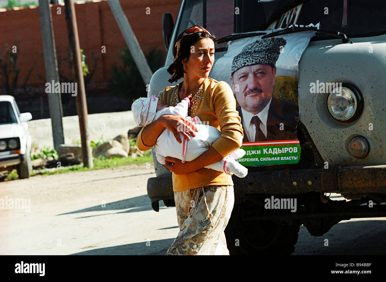 A young Chechen woman with her baby against the background of a ...