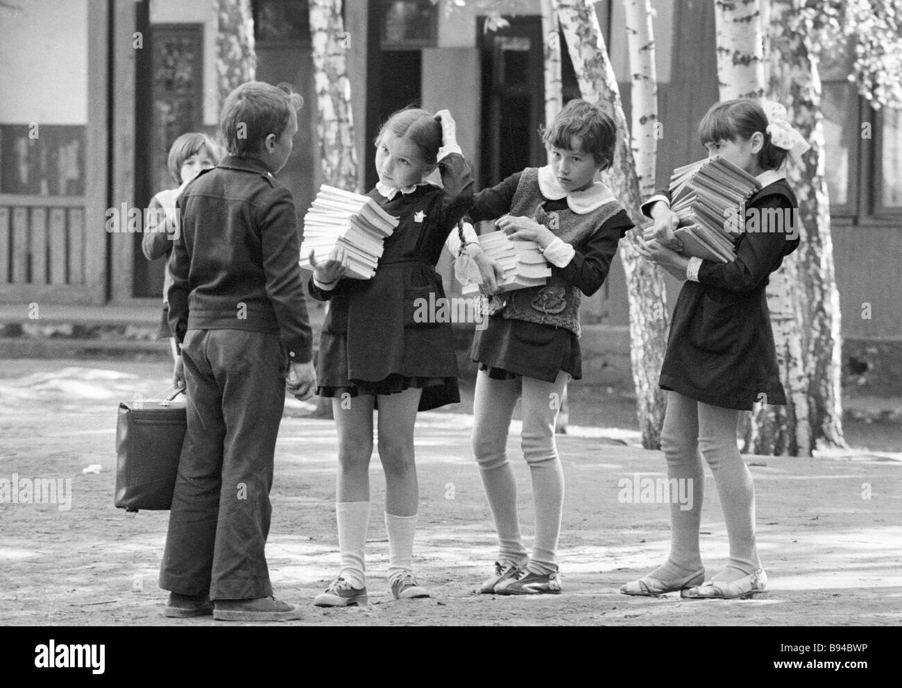 Secondary school students carrying textbooks Stock Photo - Alamy