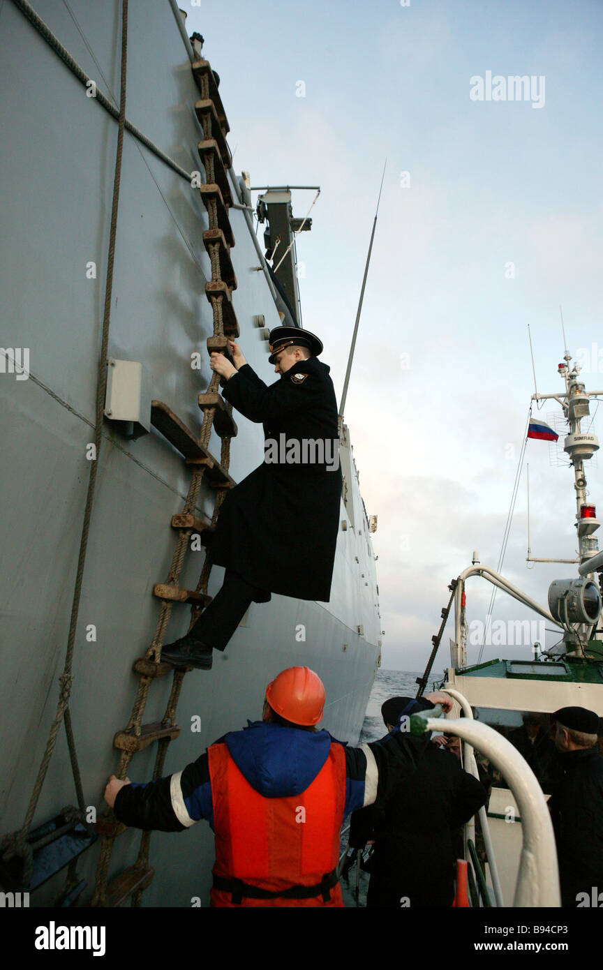 Russian sailors climbing aboard the Spanish flagship Alvaro de Bazan at ...