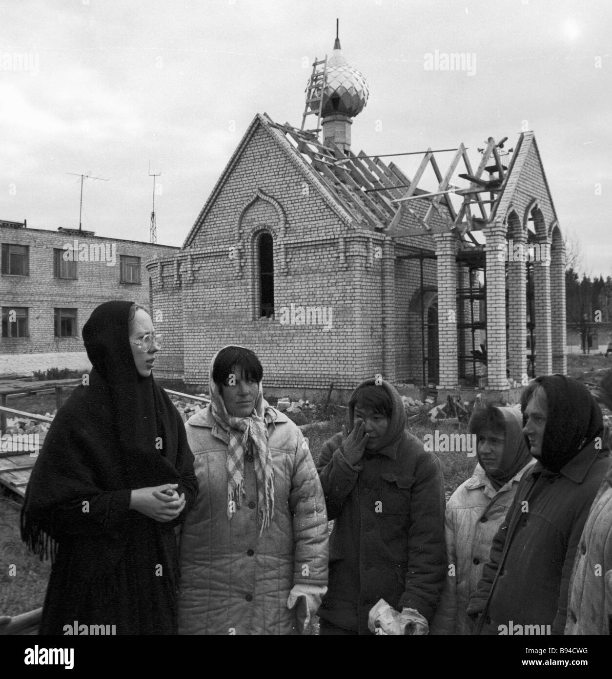 Women from a prison talking to a nun Construction of the church in ...