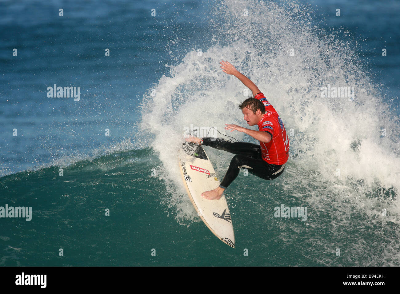 A Surfer riding a wave Stock Photo - Alamy