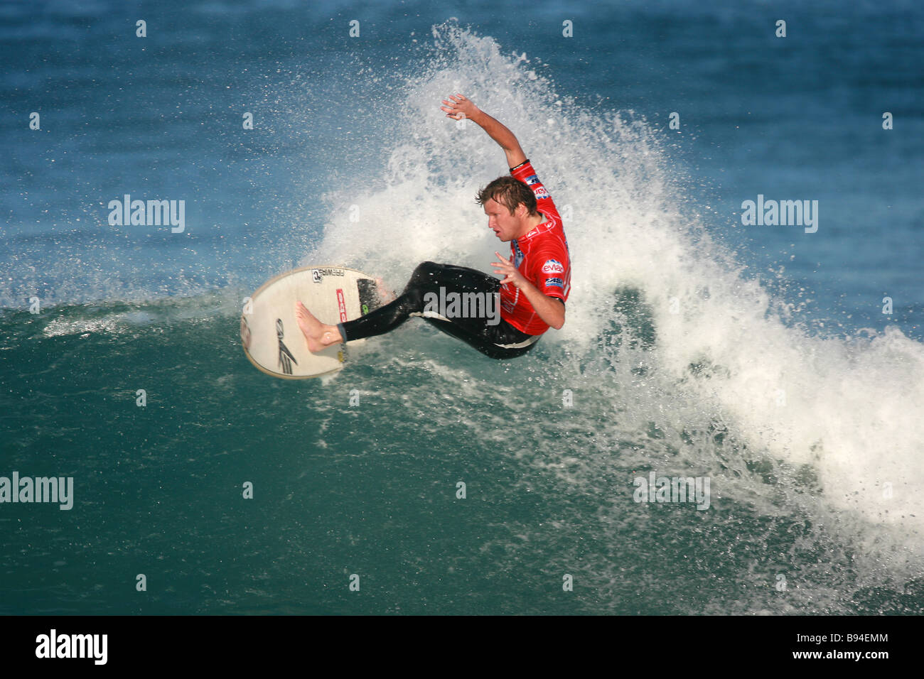 A Surfer riding a wave Stock Photo - Alamy