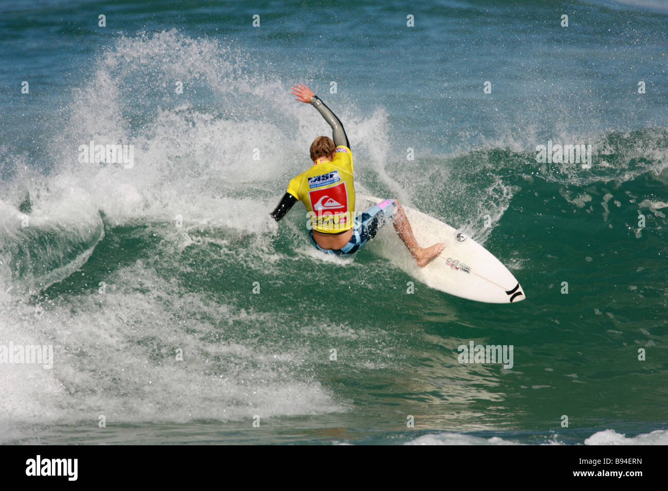 A Surfer riding a wave Stock Photo - Alamy
