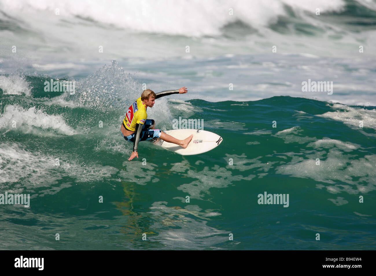 A Surfer riding a wave Stock Photo - Alamy