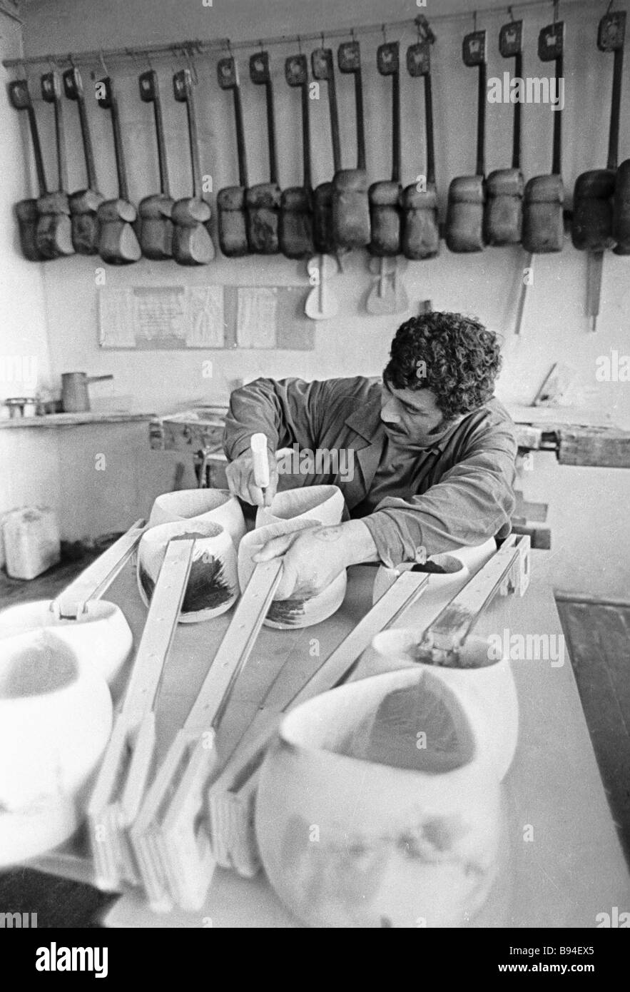 Making a tar string instrument at an Oriental musical instrument ...