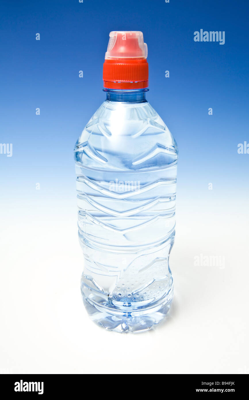 Bottled water on a graduated blue studio background Stock Photo - Alamy