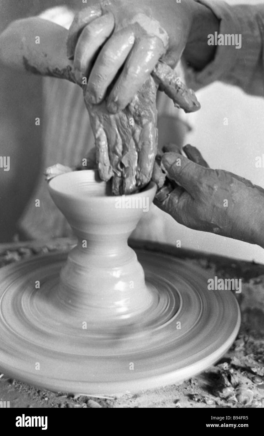 Learning to work on a wheel Stock Photo - Alamy