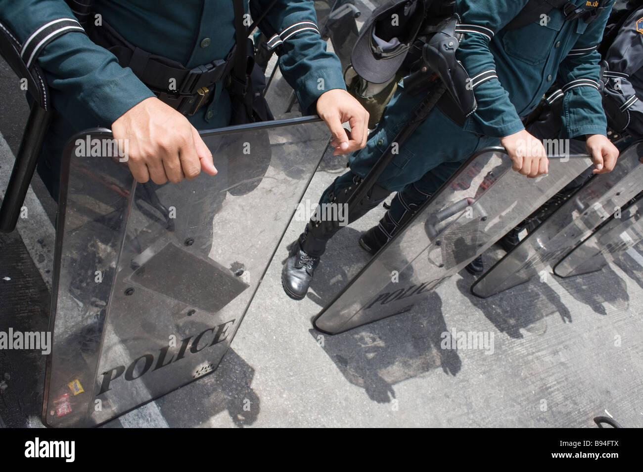 A group of Thai police officers holding riot shields Stock Photo - Alamy