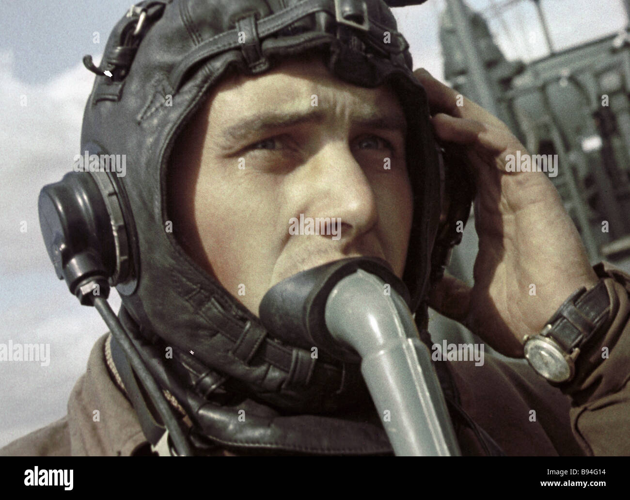 Engineer controlling the work of divers who laying a pipeline on the ...