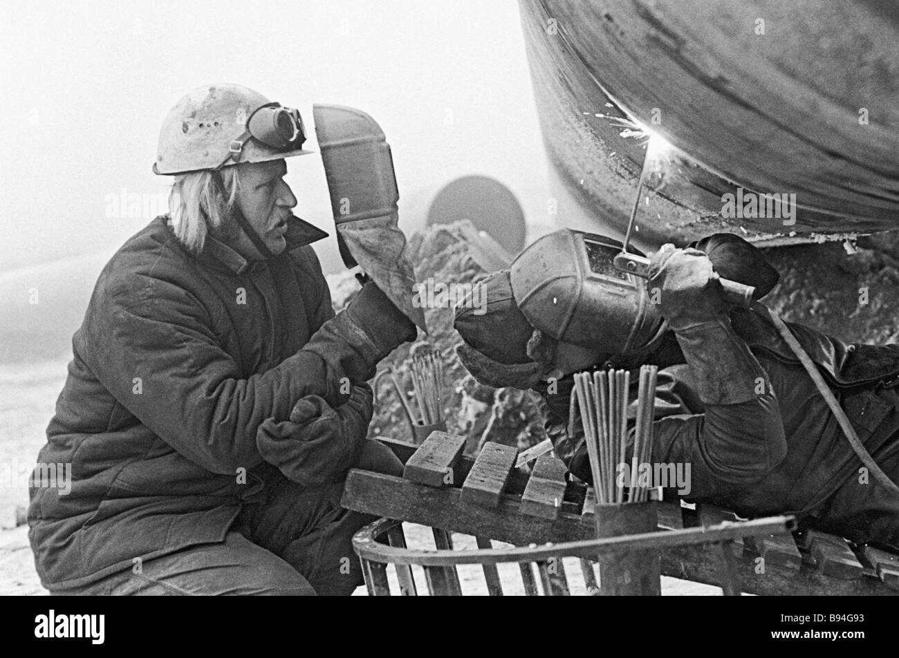 Welders from the German Democratic Republic working at the fourth ...