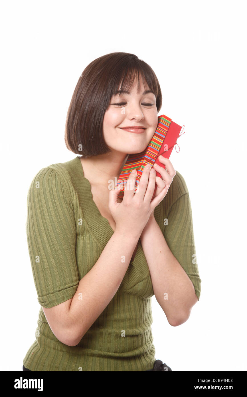 Woman hugging red gift box Stock Photo - Alamy