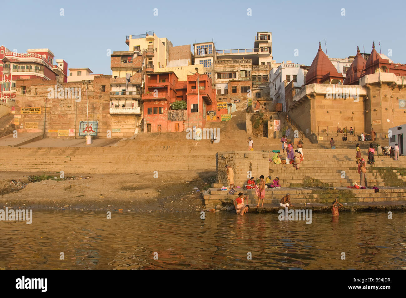 Traditional morning ablution at the ghats Varanasi Stock Photo - Alamy