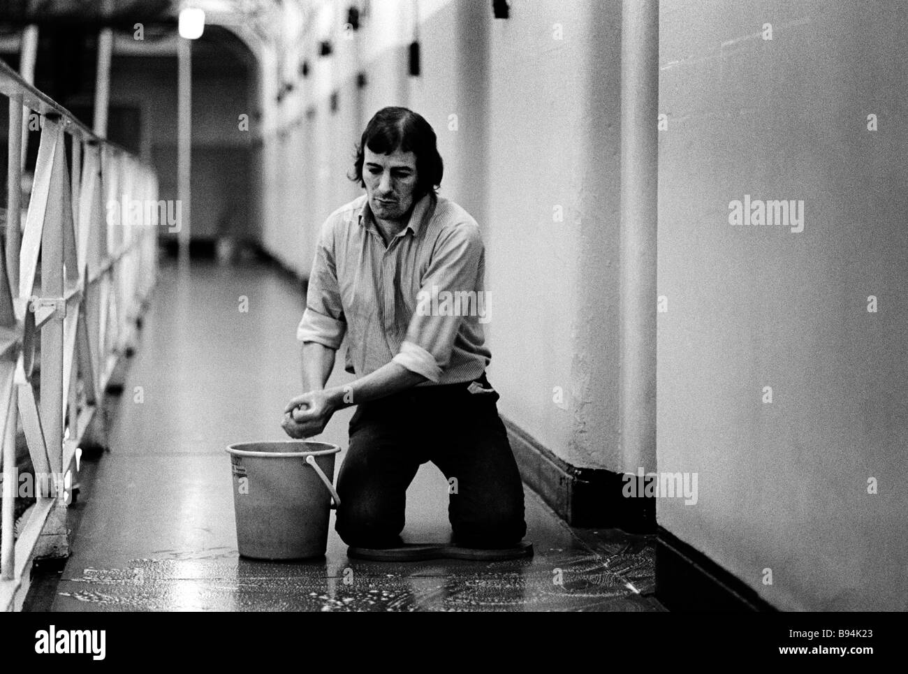 Prisoner at work cleaning the landings. Pentonville Prison, London ...