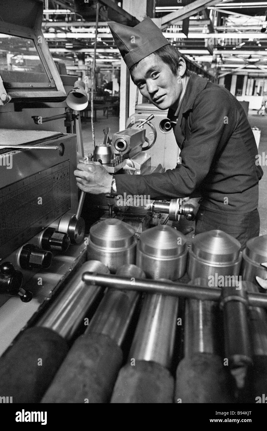 A turner from car repair factory working Stock Photo - Alamy