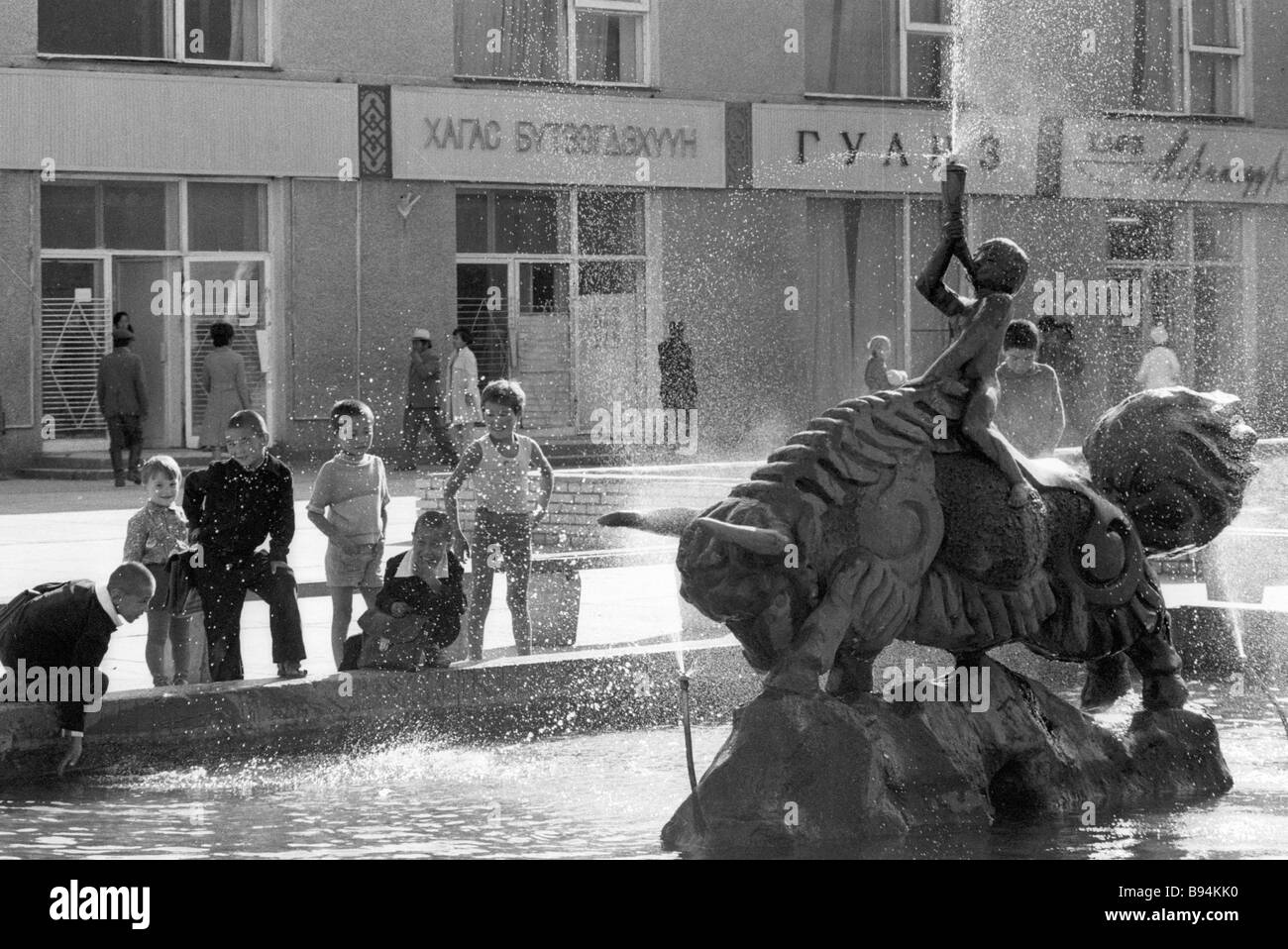 Children at the fountain in the street of Darhan Stock Photo - Alamy
