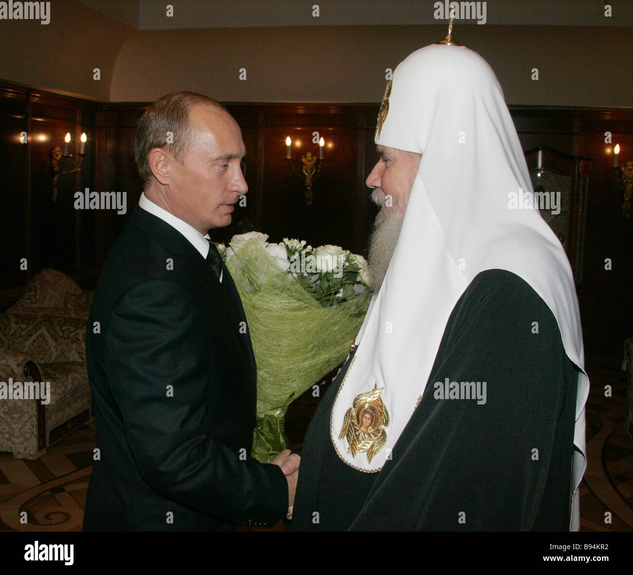 Russian President Vladimir Putin Left Congratulating Patriarch Of