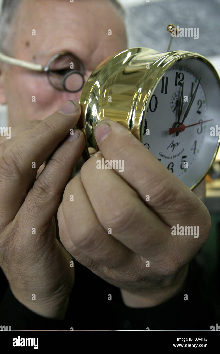 Alarm clock assembly at the Minsk watch factory Stock Photo - Alamy