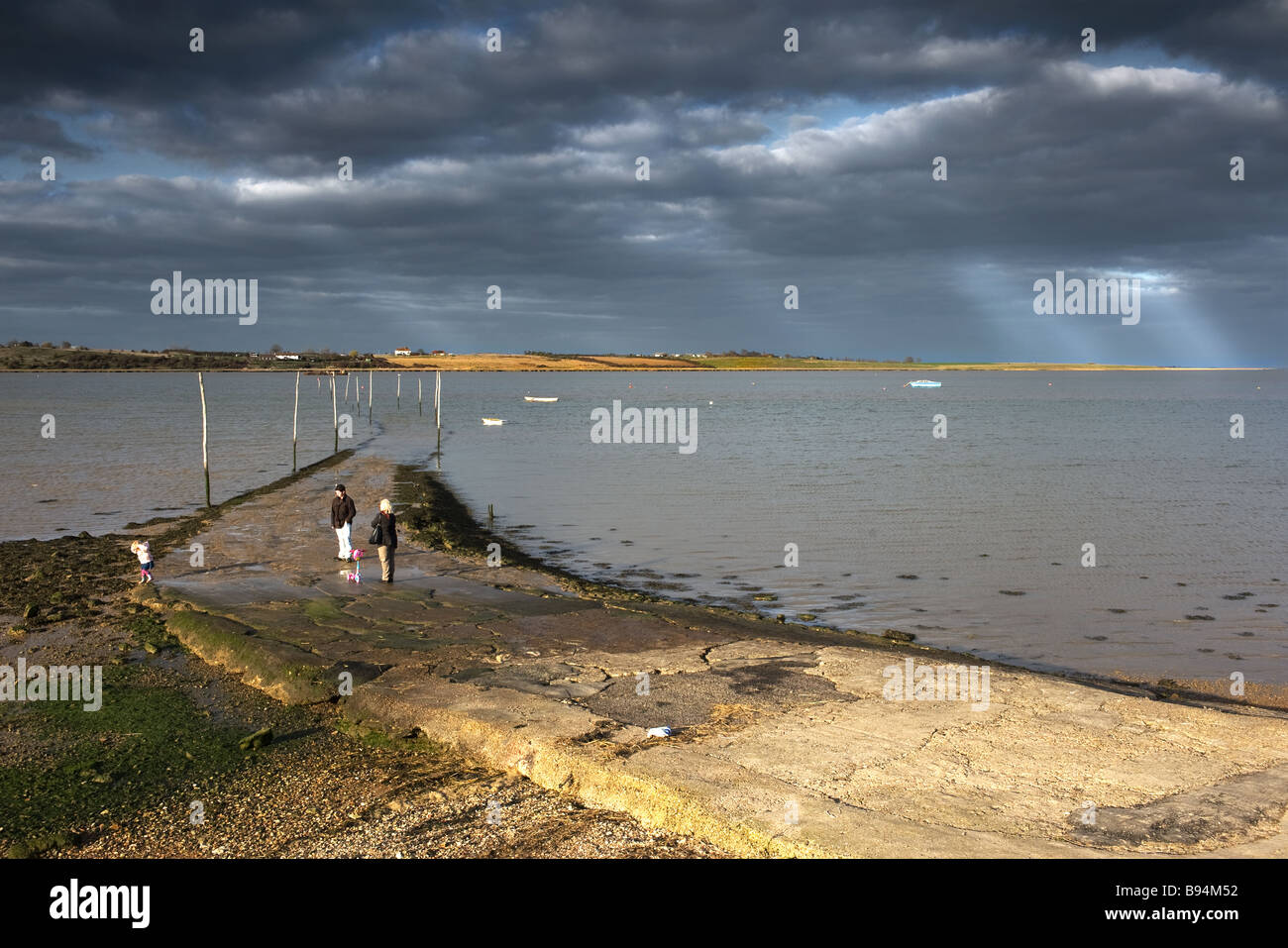 People standing on the slipway on the River Swale in Kent Stock Photo ...