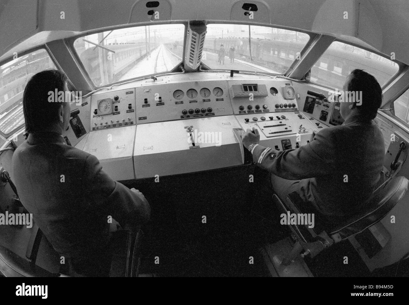 Engineers inside the ER 200 express locomotive cab Stock Photo - Alamy