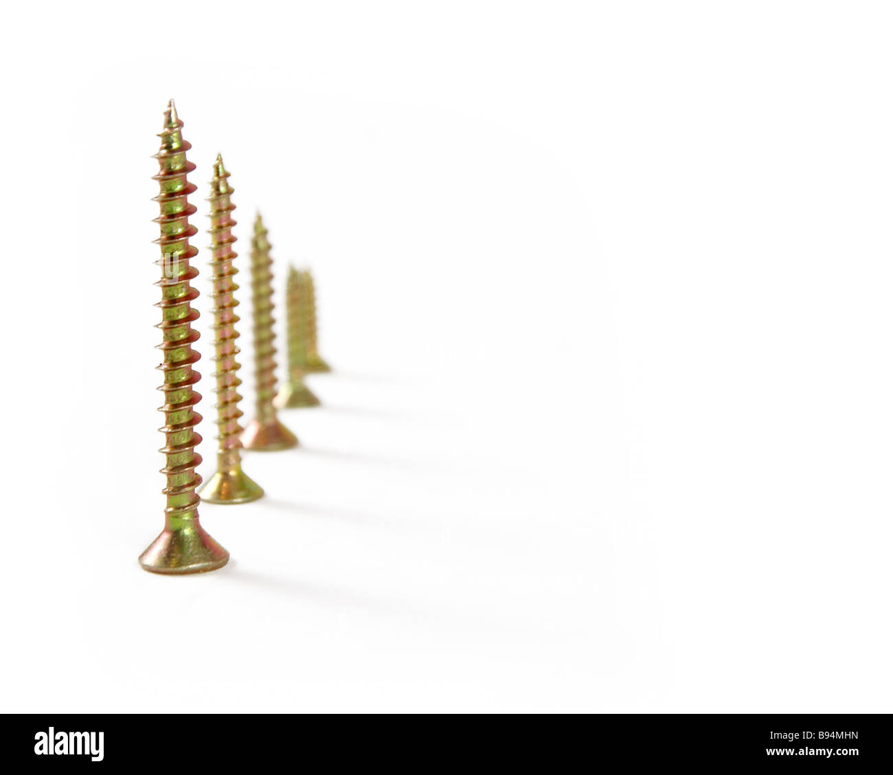 A line of receding screws Stock Photo - Alamy
