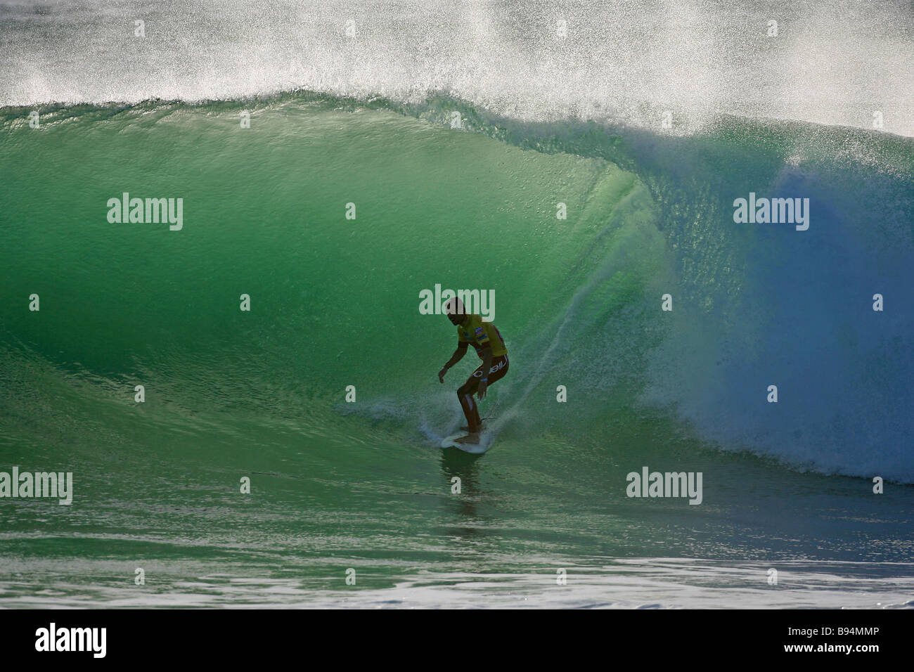 A Surfer riding a wave Stock Photo - Alamy