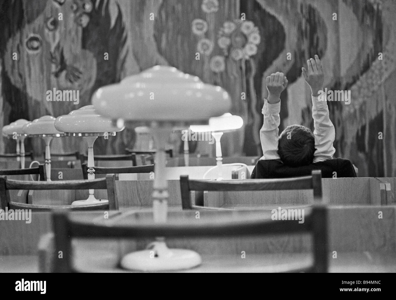A boy sitting in the reading hall of the children s republican library ...