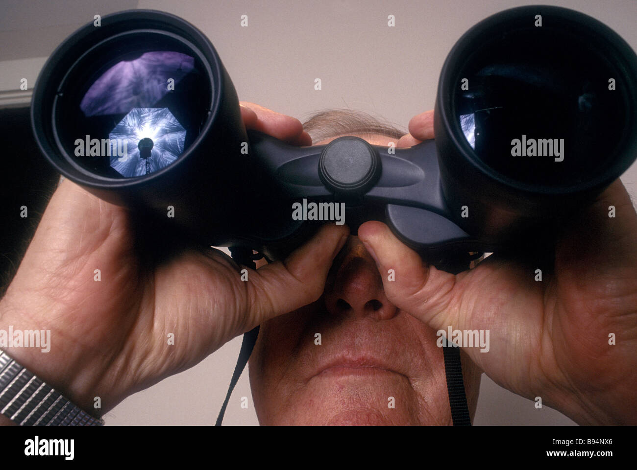 Looking through Binoculars Stock Photo - Alamy