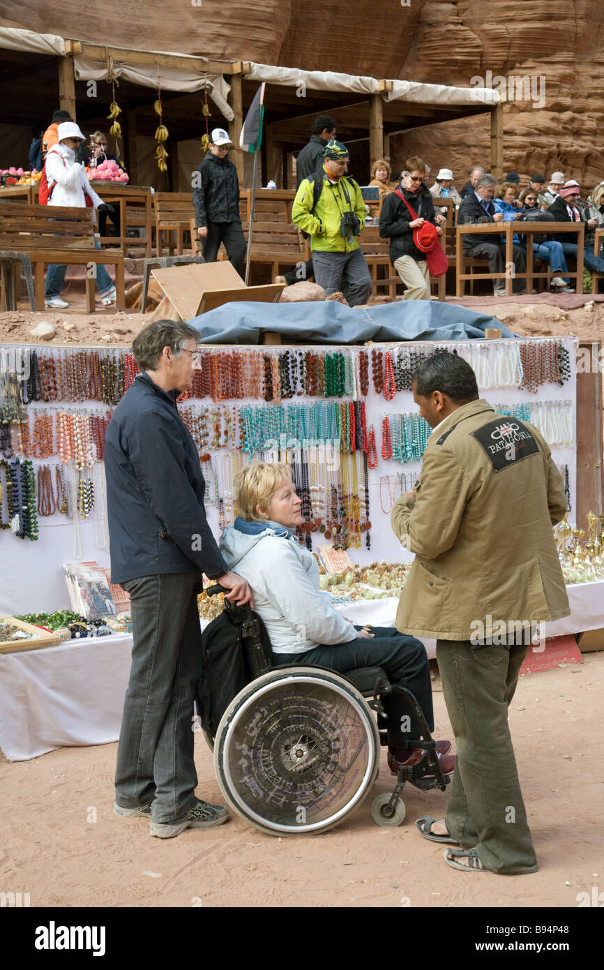 A disabled lady in a wheelchair buying souvenirs, Petra, Jordan Stock ...