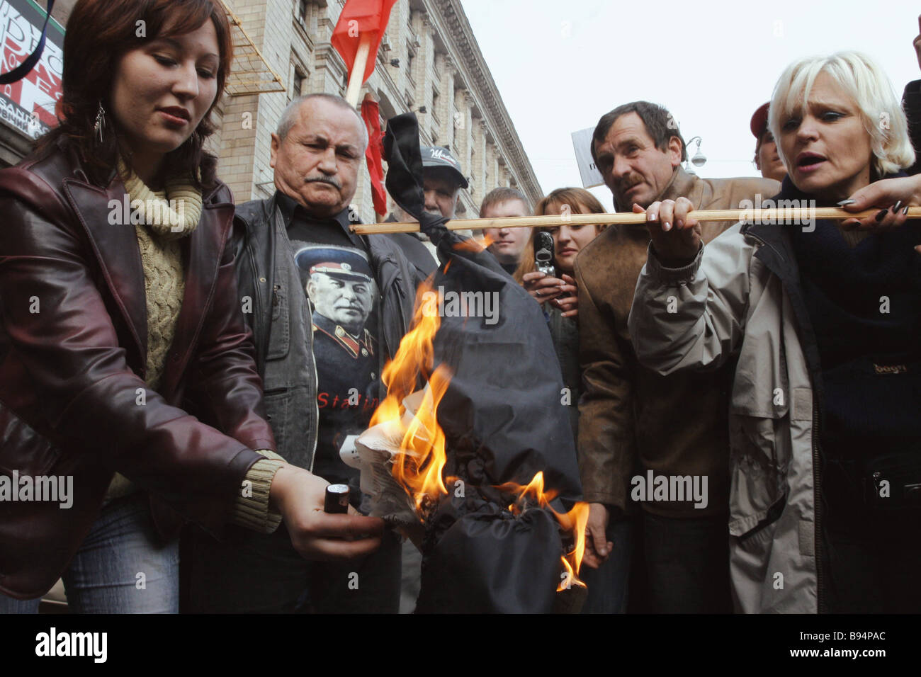 Activists of the Progressive Socialist Party burning the flag of the ...