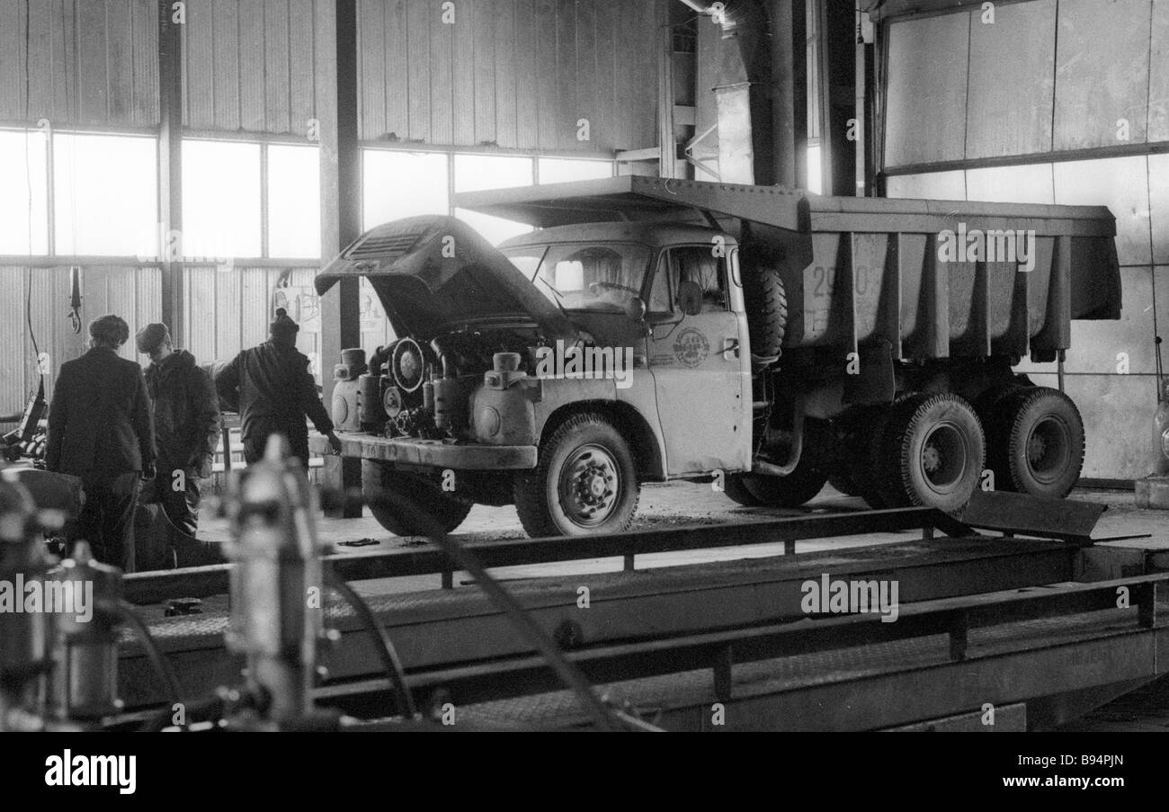 Workers of the Nizhnevartovsk automotive factory repair Tatra truck at ...