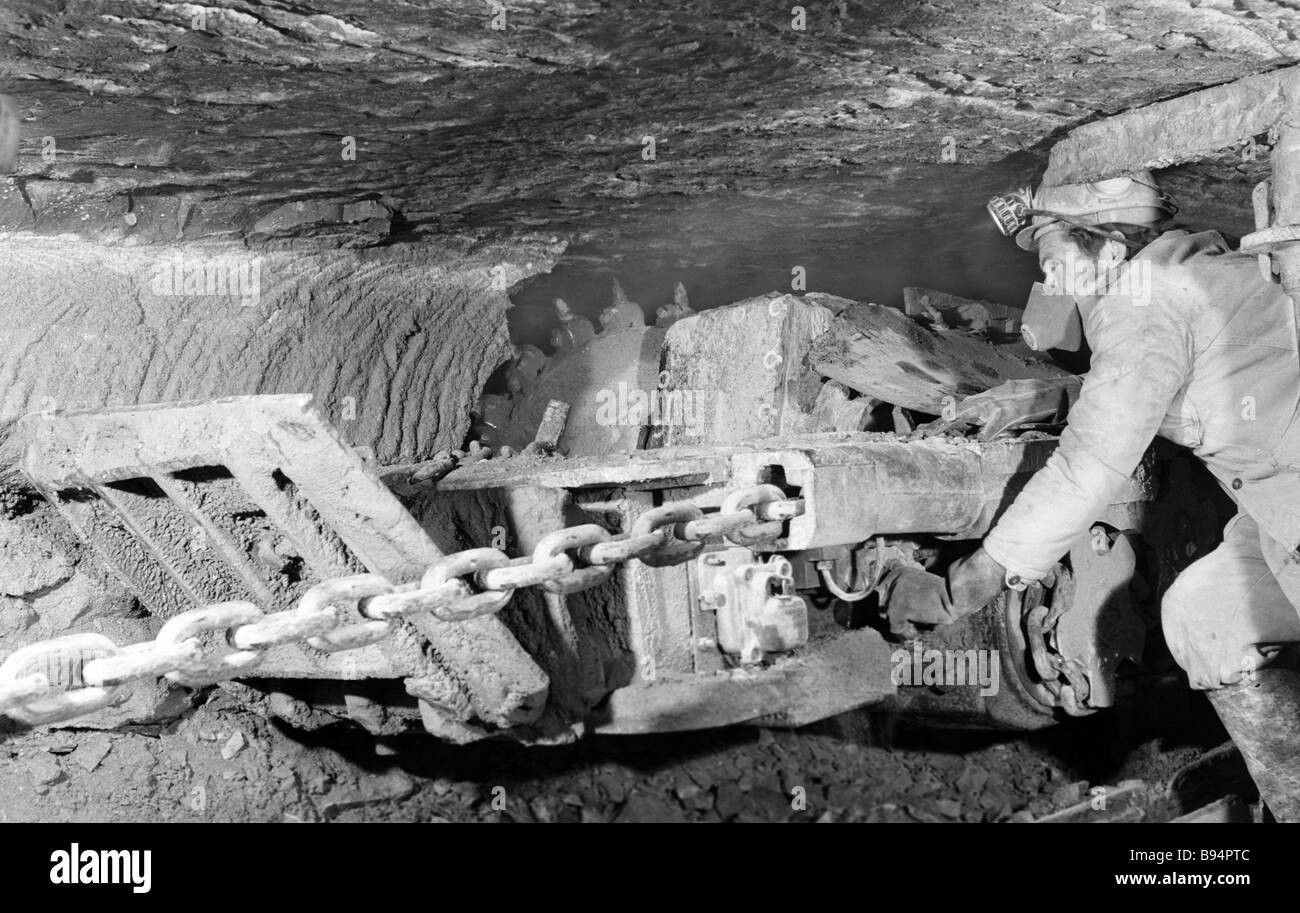 A miner watching the operation of a cutter loader at the mechanized ...