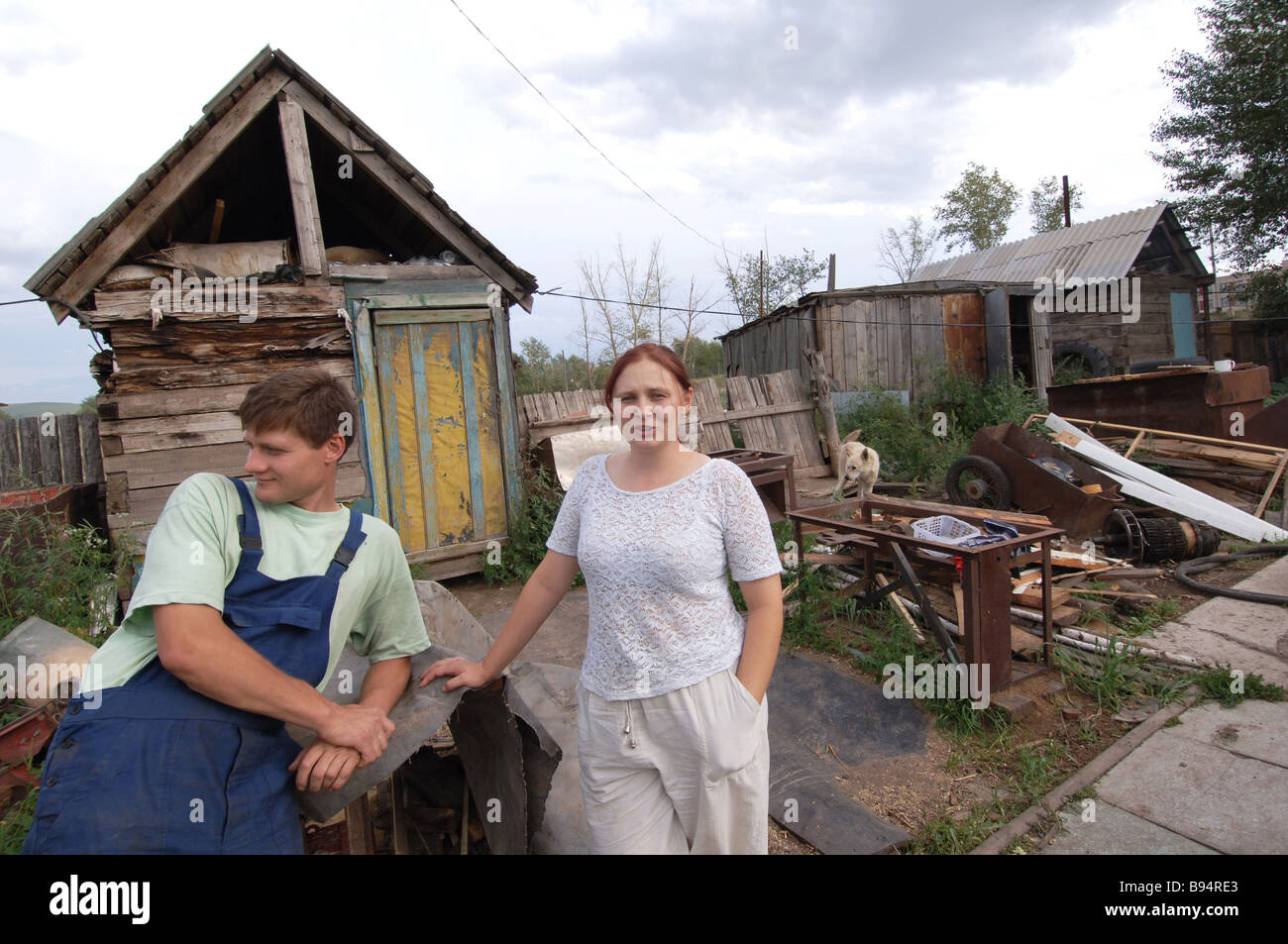 Coal mining family in the yard of their shabby house Roman and Natalya ...