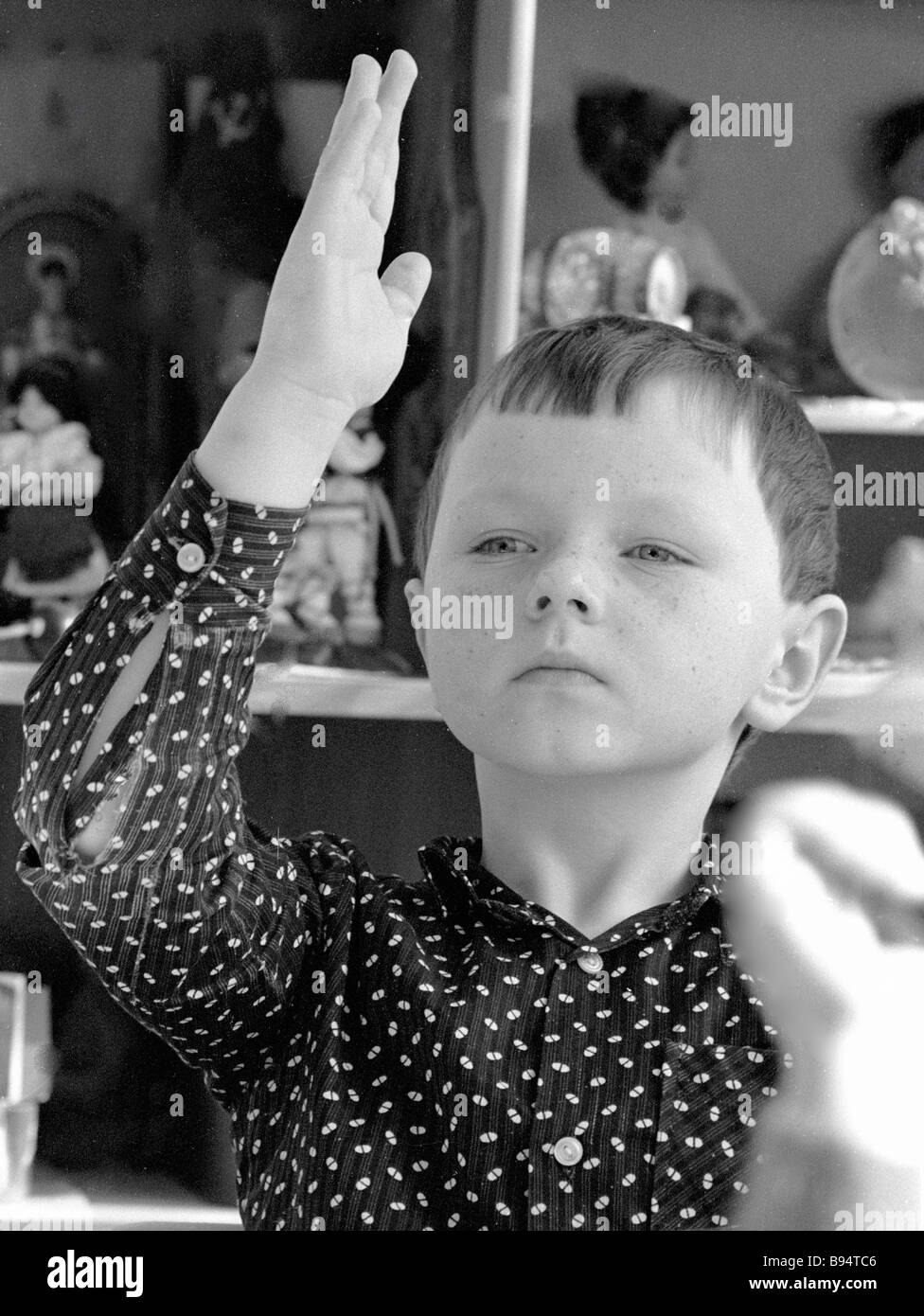 A zero grade pupil at school 2 raises his hand to answer a teacher s ...