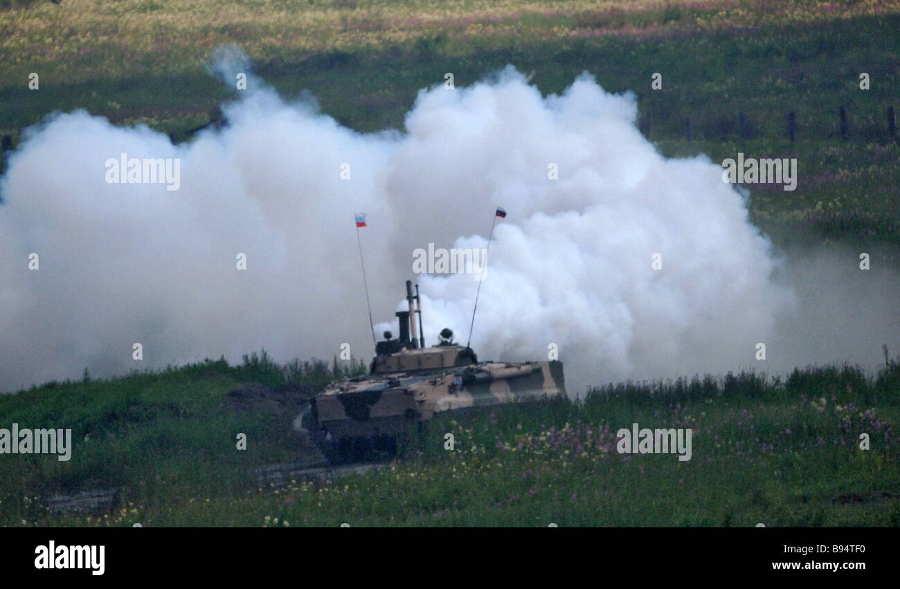 The armored infantry carrier BMP 3 demonstrating its running and firing ...