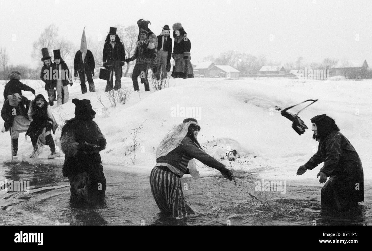 Villagers dressed as fairy tale characters bath in the river during the ...