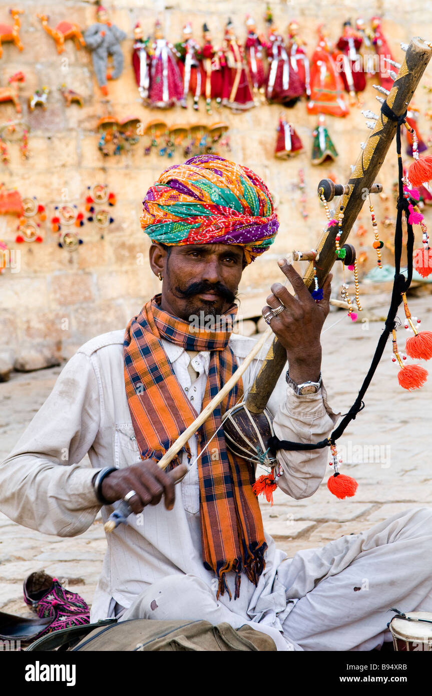 Playing his traditional musical instrument Stock Photo - Alamy