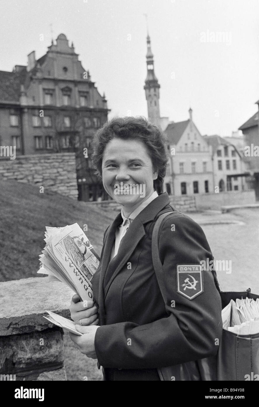 A post woman delivering mail Stock Photo - Alamy