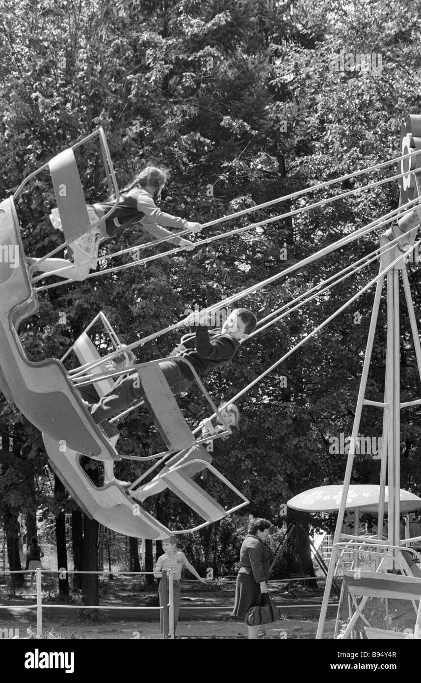 Children teetering in a park Stock Photo - Alamy