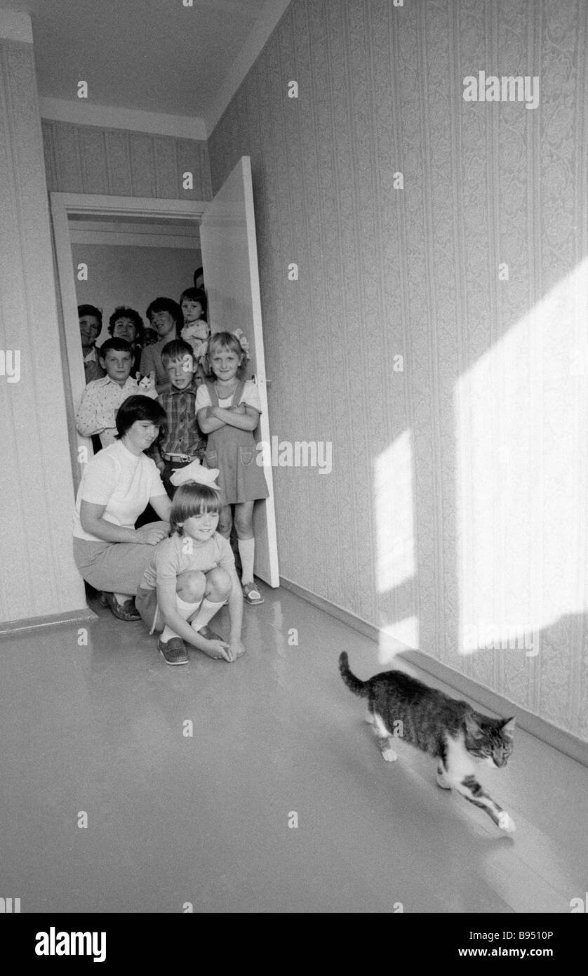 Evacuees from the Chernobyl nuclear reactor area let the cat first into ...