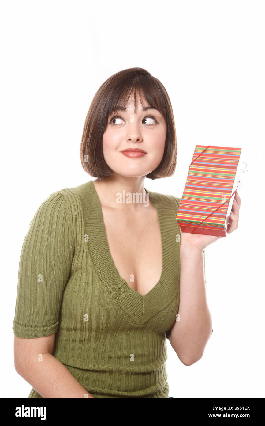 Woman showing off holding red box hi-res stock photography and images ...