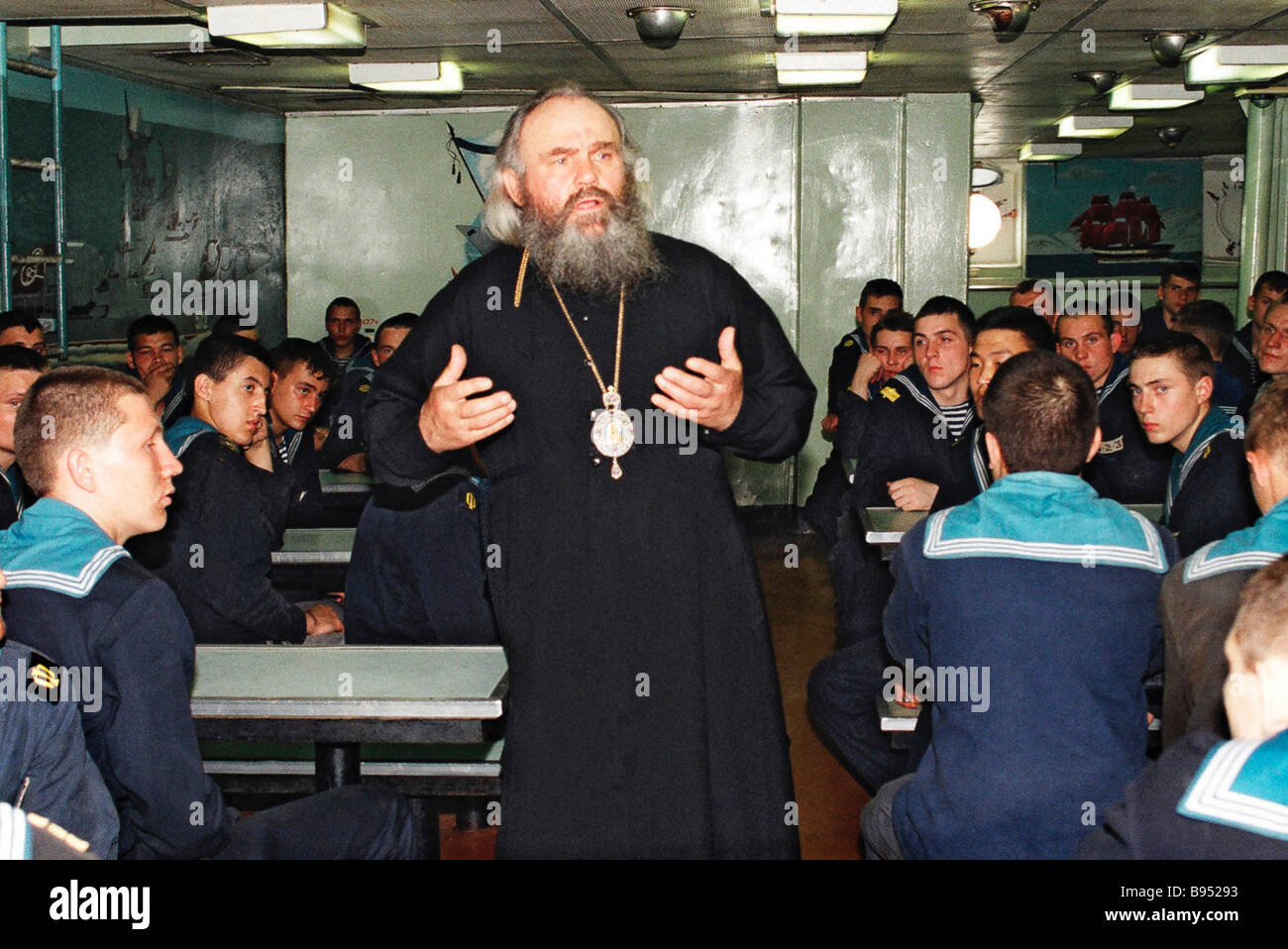 A priest preaching a sermon on board the Varyag cruiser Stock Photo - Alamy